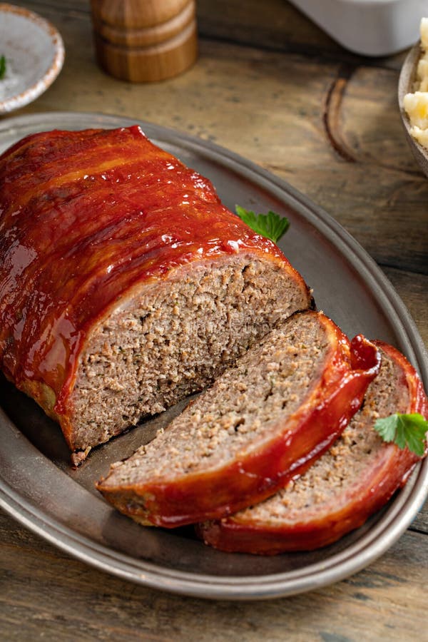 Bacon Wrapped Meatloaf Sliced on a Serving Plate Stock Image - Image of ...