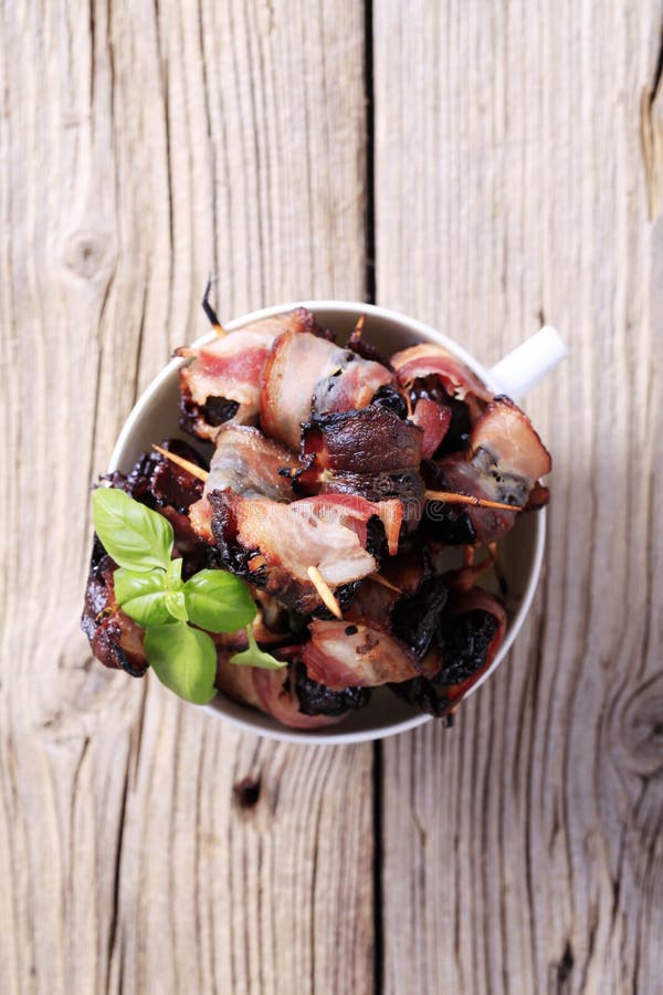 Bacon wrapped prunes stock image. Image of gourmet, meat - 21340397