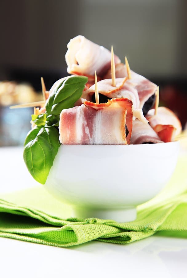 Bacon wrapped prunes stock image. Image of bites, bowl - 23405019