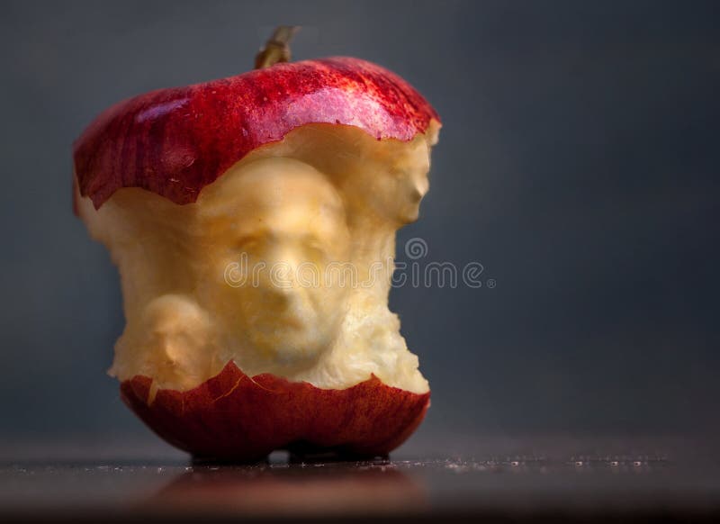 Bad Apple Surreal Faces Carved into the Core Stock Photo - Image of ...