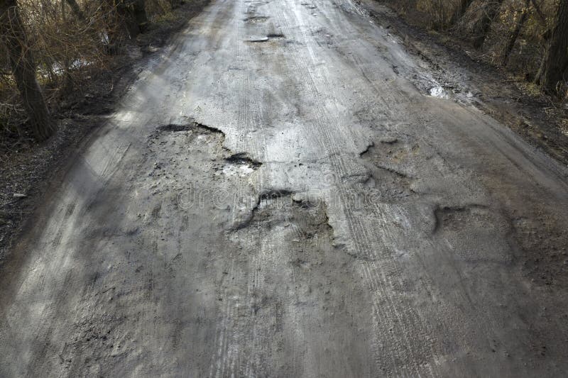Large Pits are Filled with Water on an Asphalt Road Stock Photo - Image ...