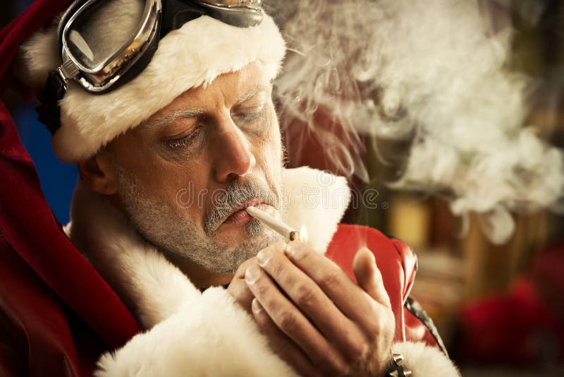 Bad Santa smoking a joint stock photo. Image of marijuana - 34767920