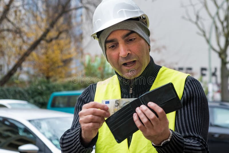 Bad Surprise: Construction Worker and His Empty Wallet Stock Photo ...