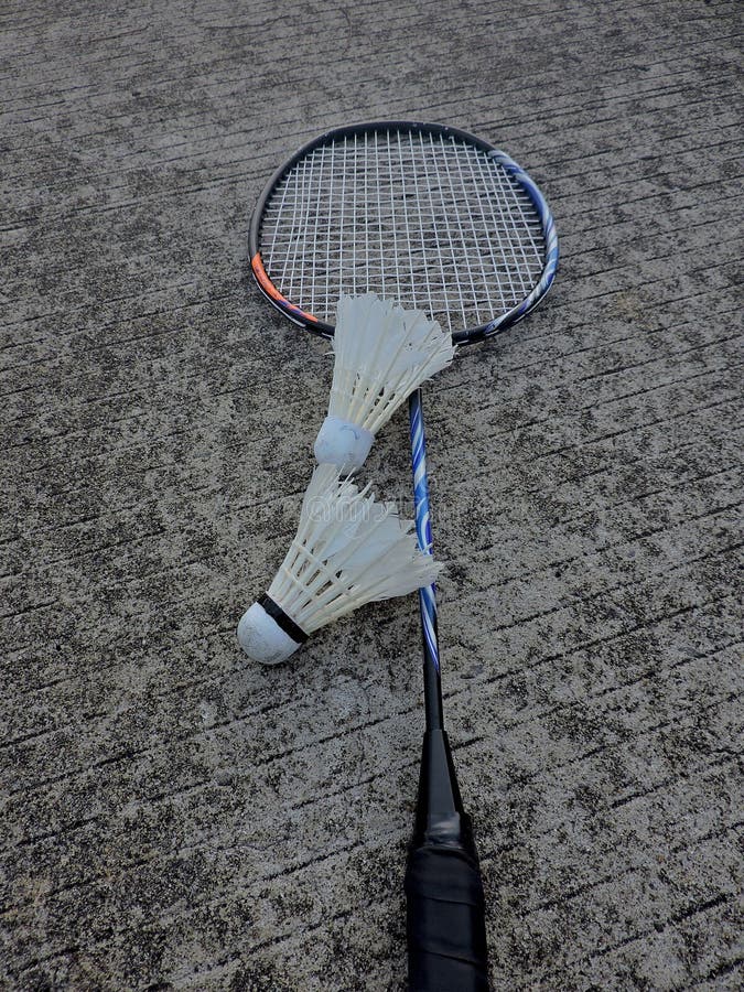 Badminton Racket and Shuttlecocks on Concrete Court Stock Image - Image ...