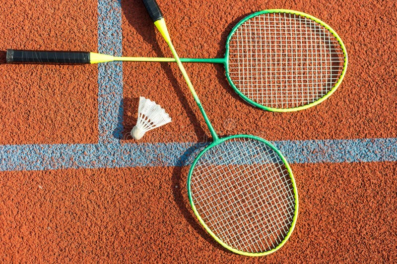 Badminton Rackets and Feather Shuttlecock on the Court Stock Photo ...