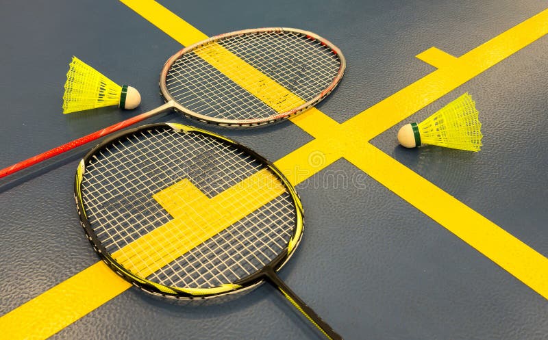 Badminton Rackets and Feather Shuttlecock on the Court Stock Photo ...