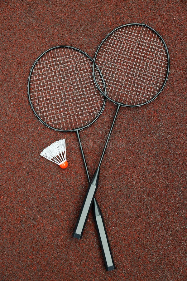 Badminton Rackets and Shuttlecock on Playground Rubber Coating Stock ...