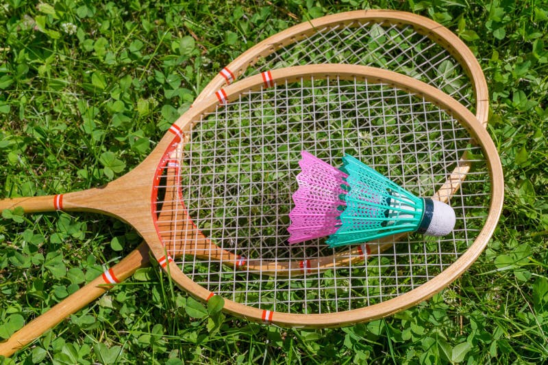 Badminton Rackets and Shuttlecocks on Grass Stock Photo - Image of ...