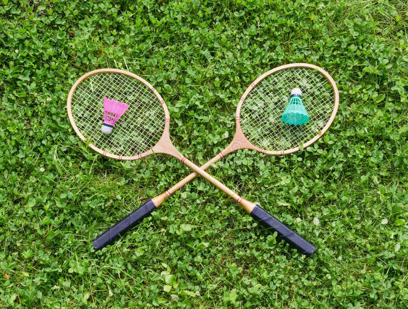 Badminton Rackets and Shuttlecocks on Grass Stock Image - Image of ...