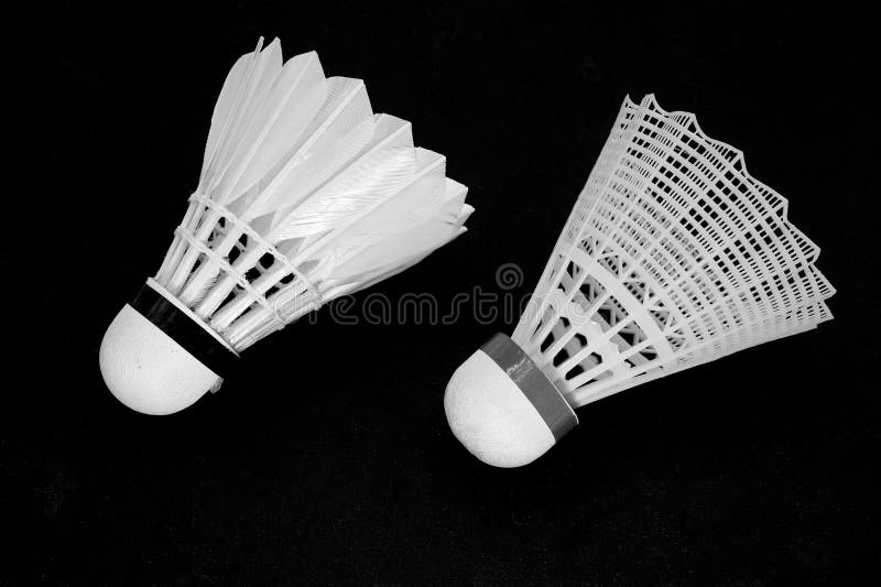 Badminton Shuttles, Both Feathered and Plastic on a Black Surface ...
