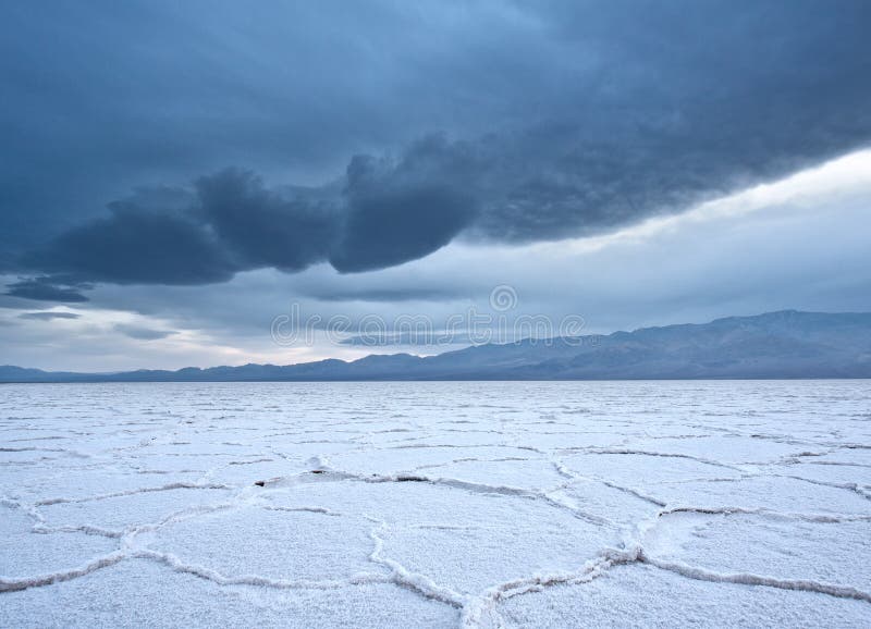Badwater Salt Flats during a Storm Stock Photo - Image of empty, flats ...