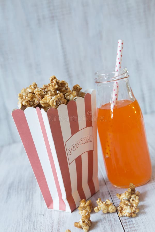 Bag of Caramel Popcorn with Orange Soda Pop Stock Image - Image of ...