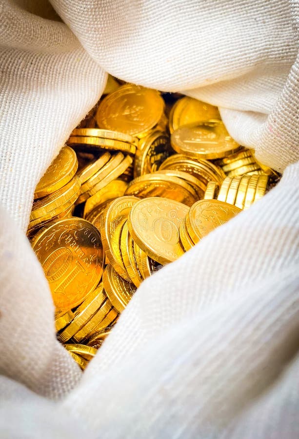 A Bag of Gold Shining in the Sun Stock Photo - Image of gold, coins ...