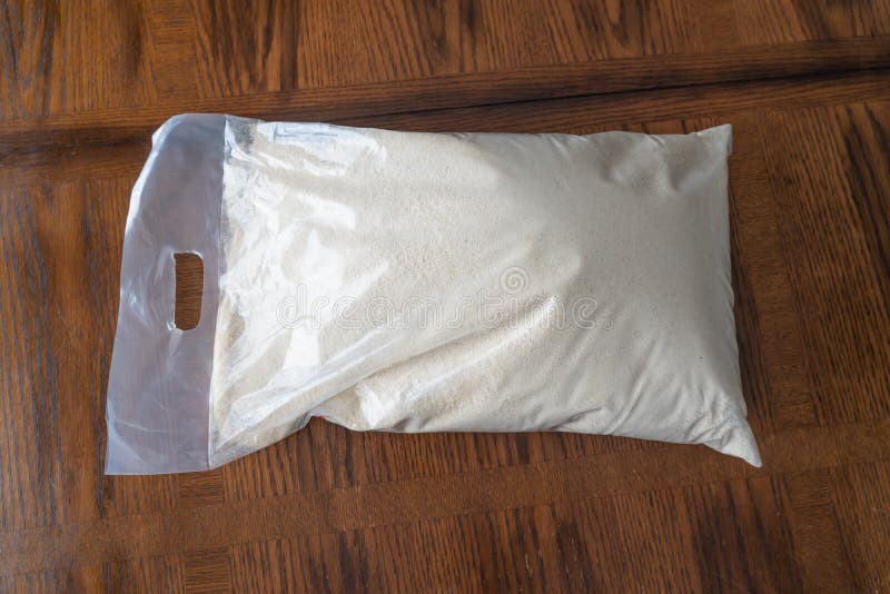 Bag of Nigerian Staple Food Garri on Table Stock Photo - Image of mudu ...