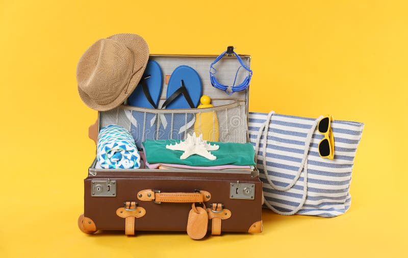 Bag and Open Vintage Suitcase with Beach Objects Packed for Summer ...
