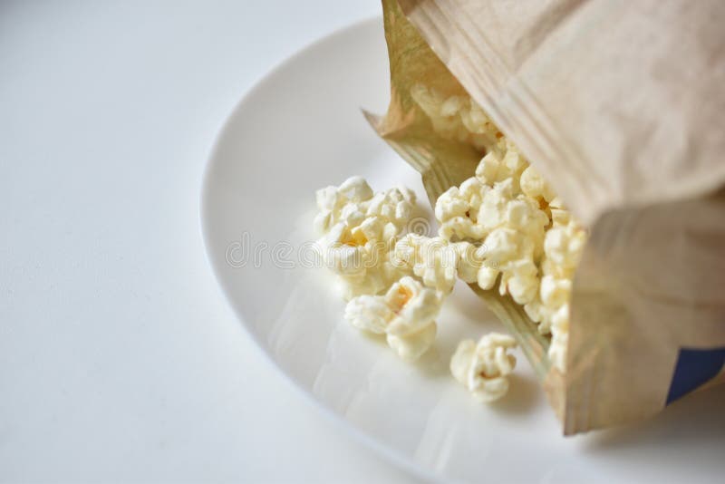 A Bag of Popcorn Open on a Plate in the Kitchen Stock Image - Image of ...