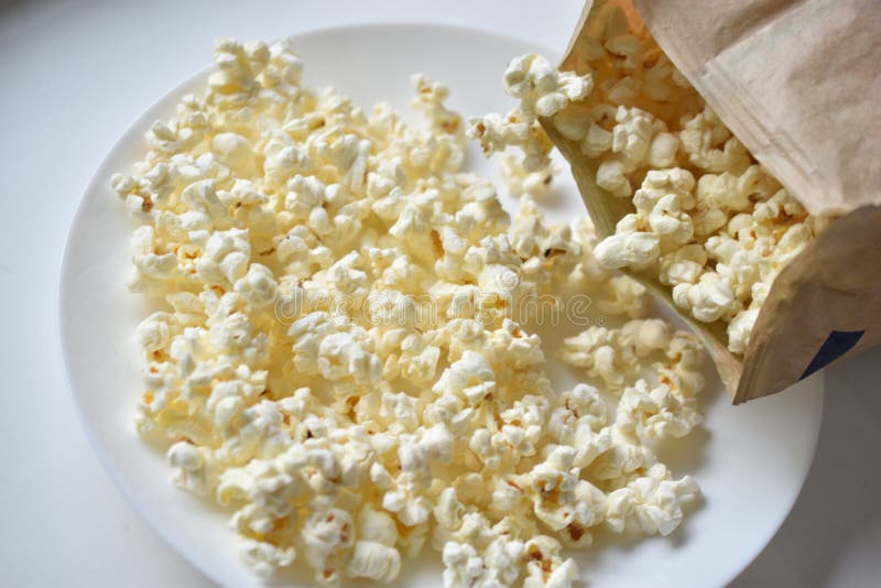 A Bag of Popcorn Open on a Plate in the Kitchen Stock Image - Image of ...