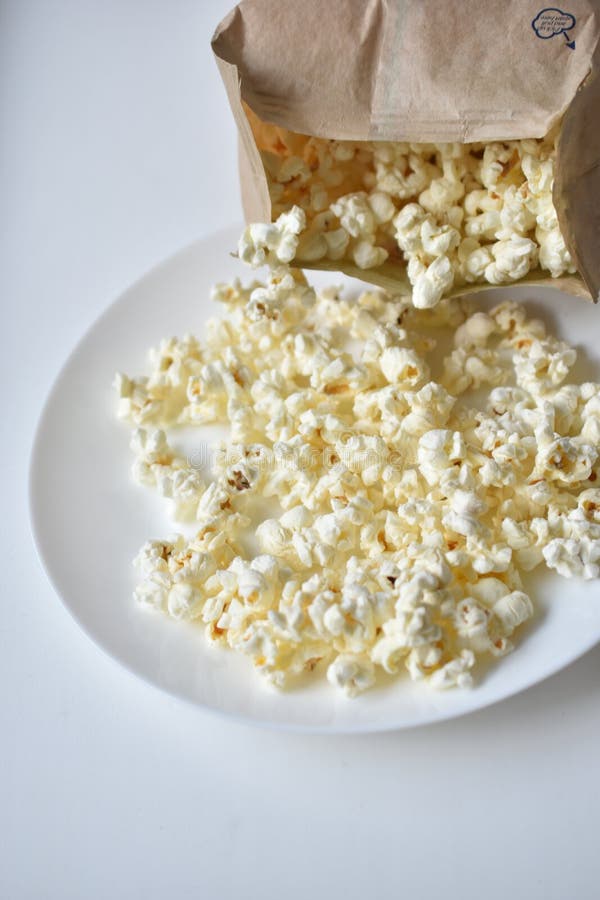 A Bag of Popcorn Open on a Plate in the Kitchen Stock Photo - Image of ...