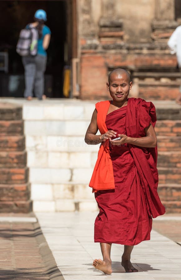 BAGAN, MYANMAR - DECEMBER 1, 2016: the Monk Walks the Temple Grounds ...