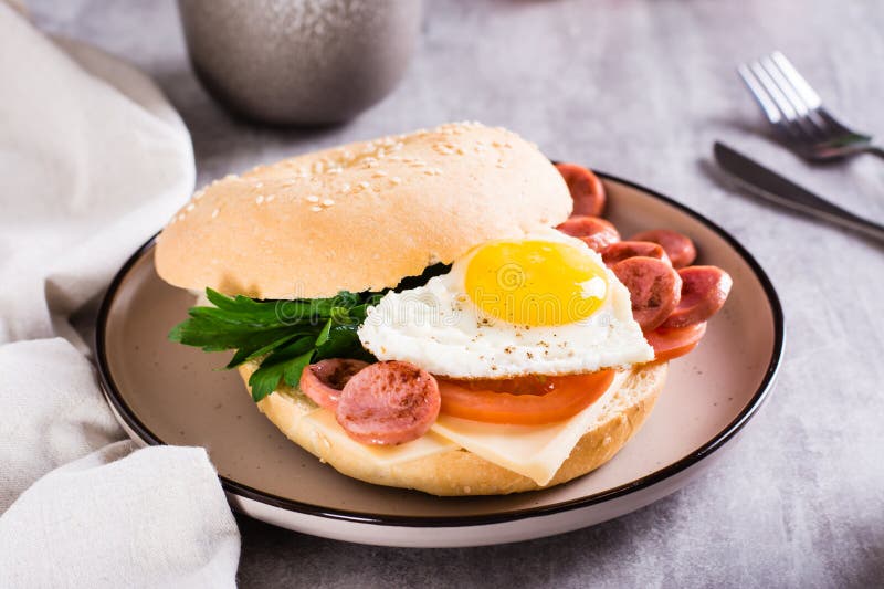 Bagel with Heart-shaped Boiled Egg, Tomato, Cheese and Herbs on a Plate ...