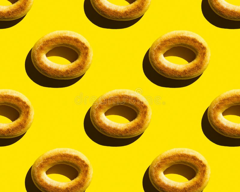 Bagel Pattern on Yellow Background Stock Image - Image of bread, bakery ...