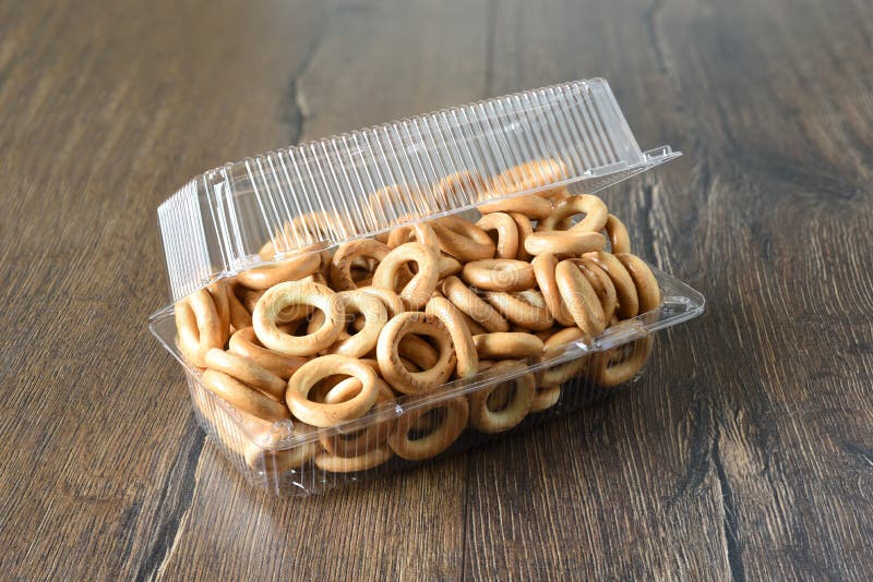 Bagels in a Plastic Container on a Wooden Table. Stock Image - Image of ...