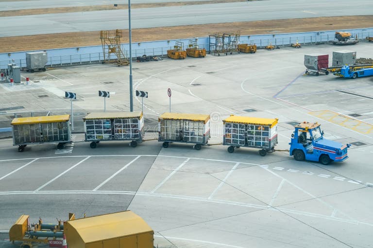 Baggage Carts in the Train Carry Passengers Suitcases for Loading Onto ...