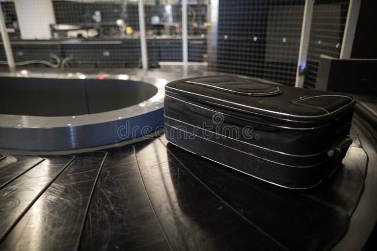 Baggage on a Conveyor Belt Inside a Luggage Sorting System at an ...
