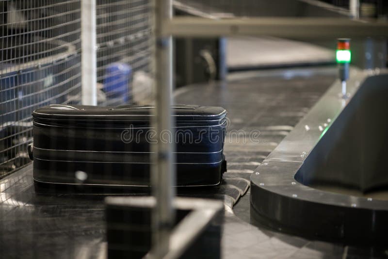 Baggage on a Conveyor Belt Inside a Luggage Sorting System at an ...