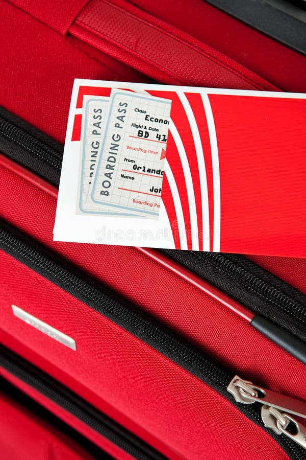 Baggage: Red Suitcase with Airline Ticket on Top Stock Photo - Image of ...