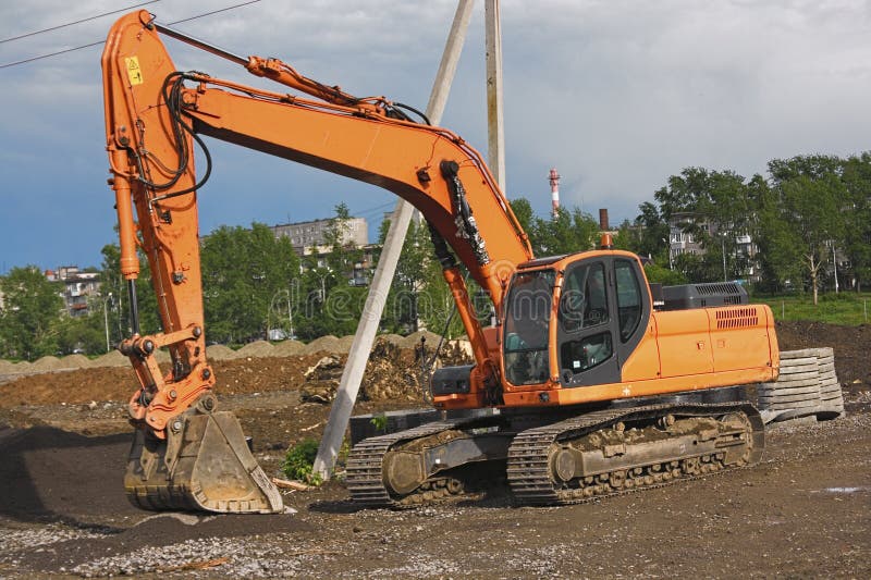 Bagger an der Baustelle stockfoto. Bild von exkavator - 105721994