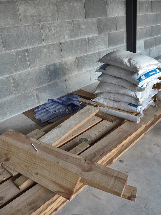 The Bags of Cement on Stack of Wood Timber Stock Image - Image of ...