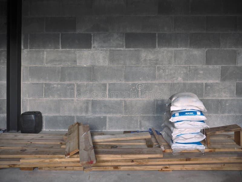 The Bags of Cement on Stack of Wood Timber Stock Image - Image of ...