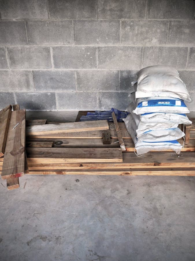 The Bags of Cement on Stack of Wood Timber Stock Image - Image of ...