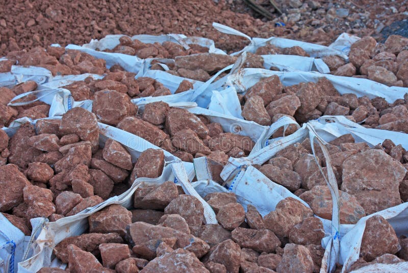 Bags of rocks stock photo. Image of concrete, building - 82844006
