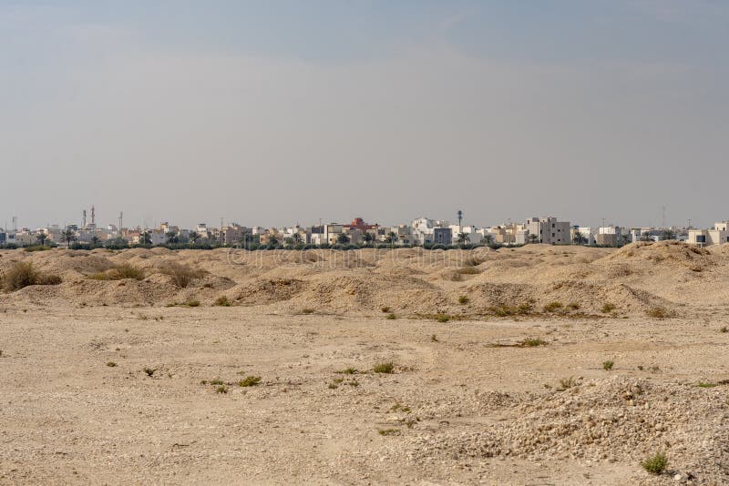 Bahrain - a Ali - Dilmun Tombs and Urban Contrast Stock Image - Image ...