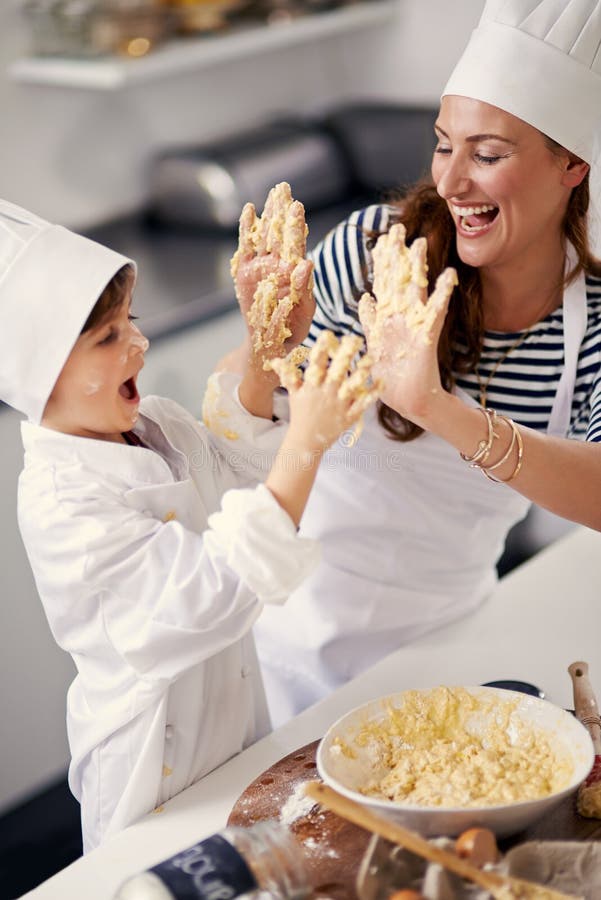 Bake the World a Better Place. a Mother and Her Son Playing with Cookie ...