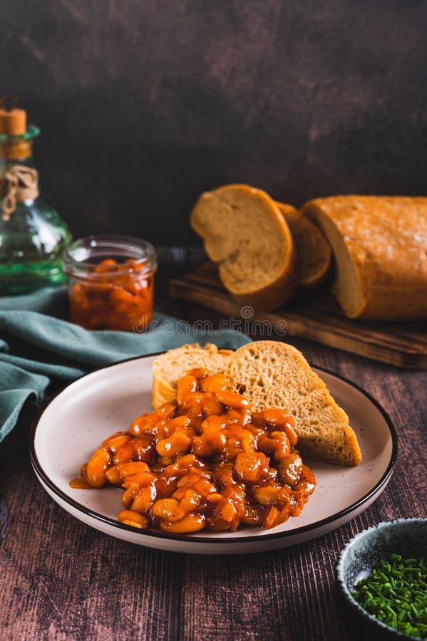 Baked Beans with Vegetables and Rye Bread on a Plate on the Table ...