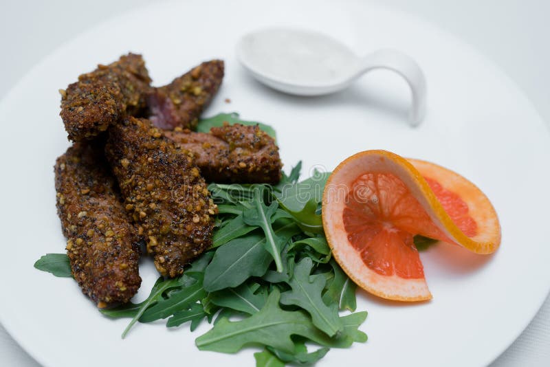Baked Beef, Arugula and a Slice of Grapefruit Stock Image - Image of ...