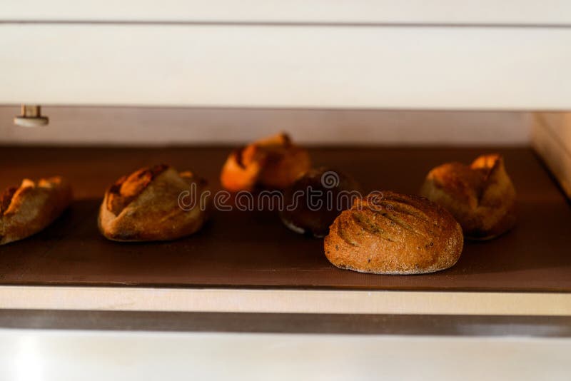 Baked bread in the oven stock image. Image of dinner - 130870969