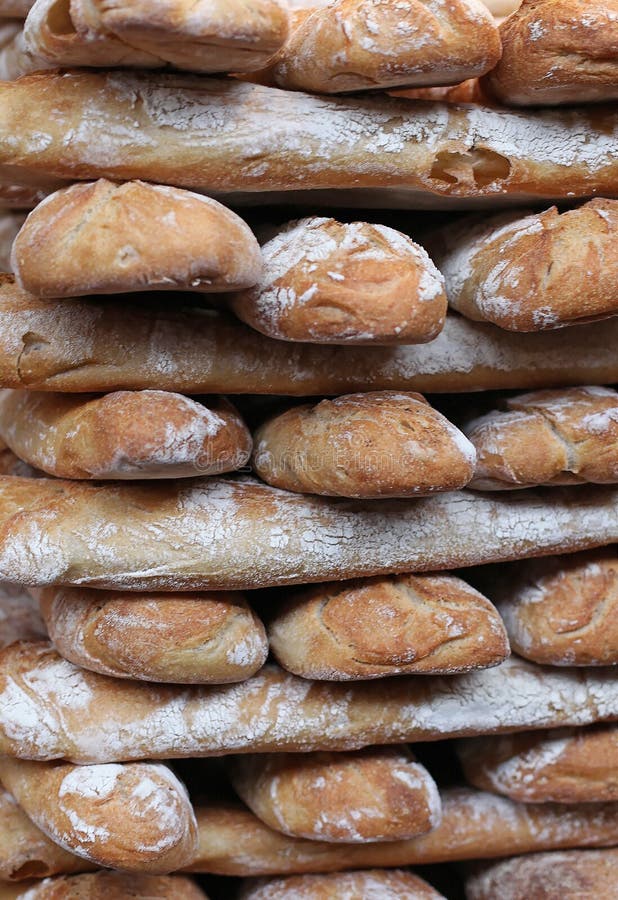 Baked bread pile stock image. Image of pile, white, loaf - 195260119