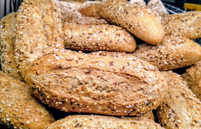 Baked bread with seeds stock image. Image of consumption - 177642997