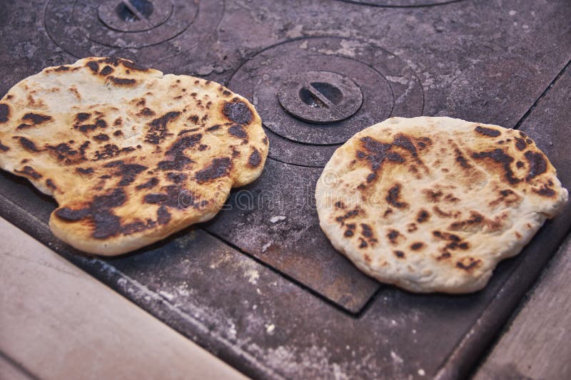 Baked bread on the stove 3 stock image. Image of indoors - 276317575