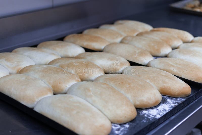 Baked Bread in Trays Ready To Be Sold Stock Photo - Image of oven ...