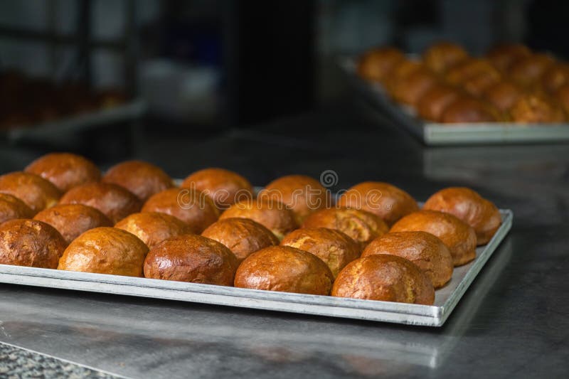 Baked Buns in Baking Pan stock photo. Image of preparation - 273640964