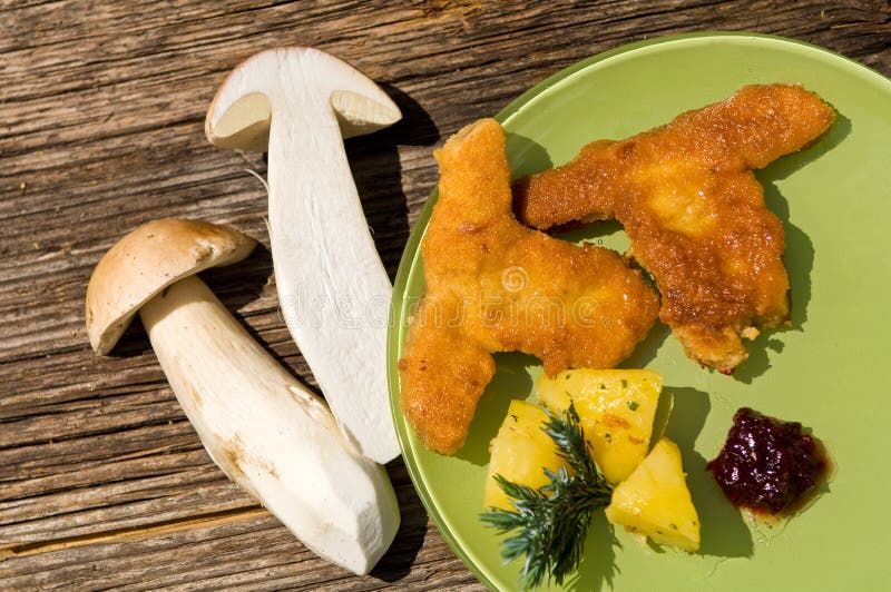 Baked Ceps with Potatoes and Herbs on Plate, Elevated View Stock Photo ...