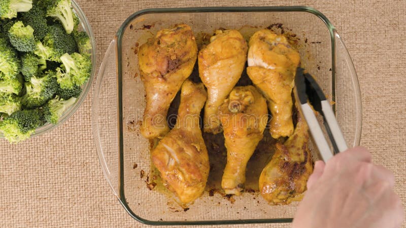 Baked Chicken Drumsticks in a Glass Baking Dish Close-up on a Kitchen ...