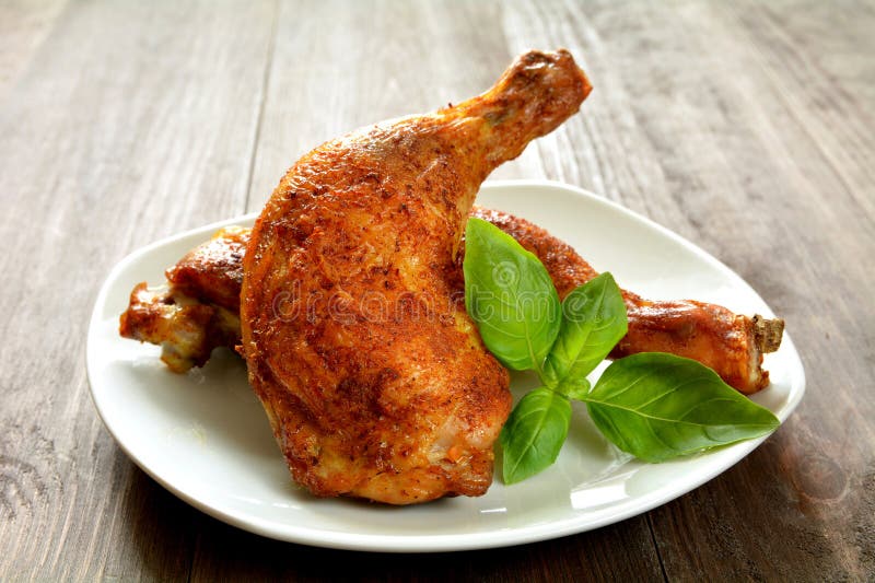 Baked chicken leg stock image. Image of basil, meat - 304794419
