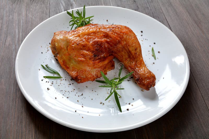 Baked chicken leg stock photo. Image of leaf, dish, food - 305941412