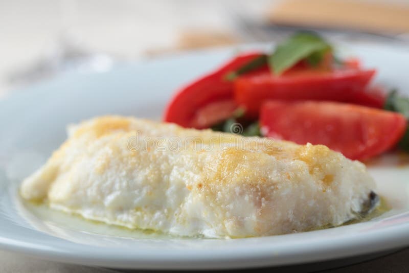 Baked Cod Fillet with Salad Stock Photo - Image of tomato, closeup ...
